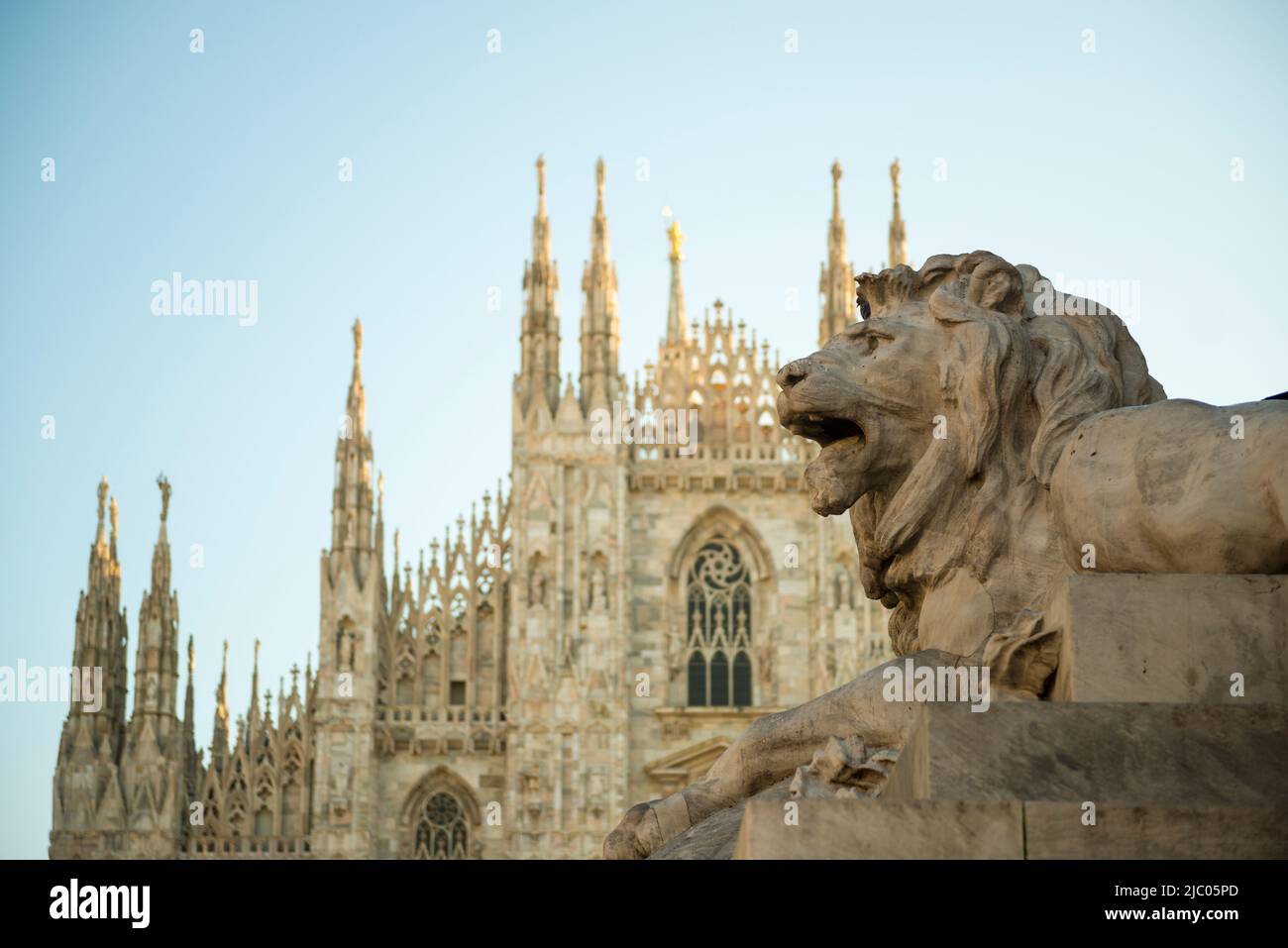 Milan Cathedral and Lion Statue with Sunlight in Lombardy, Italy Stock ...