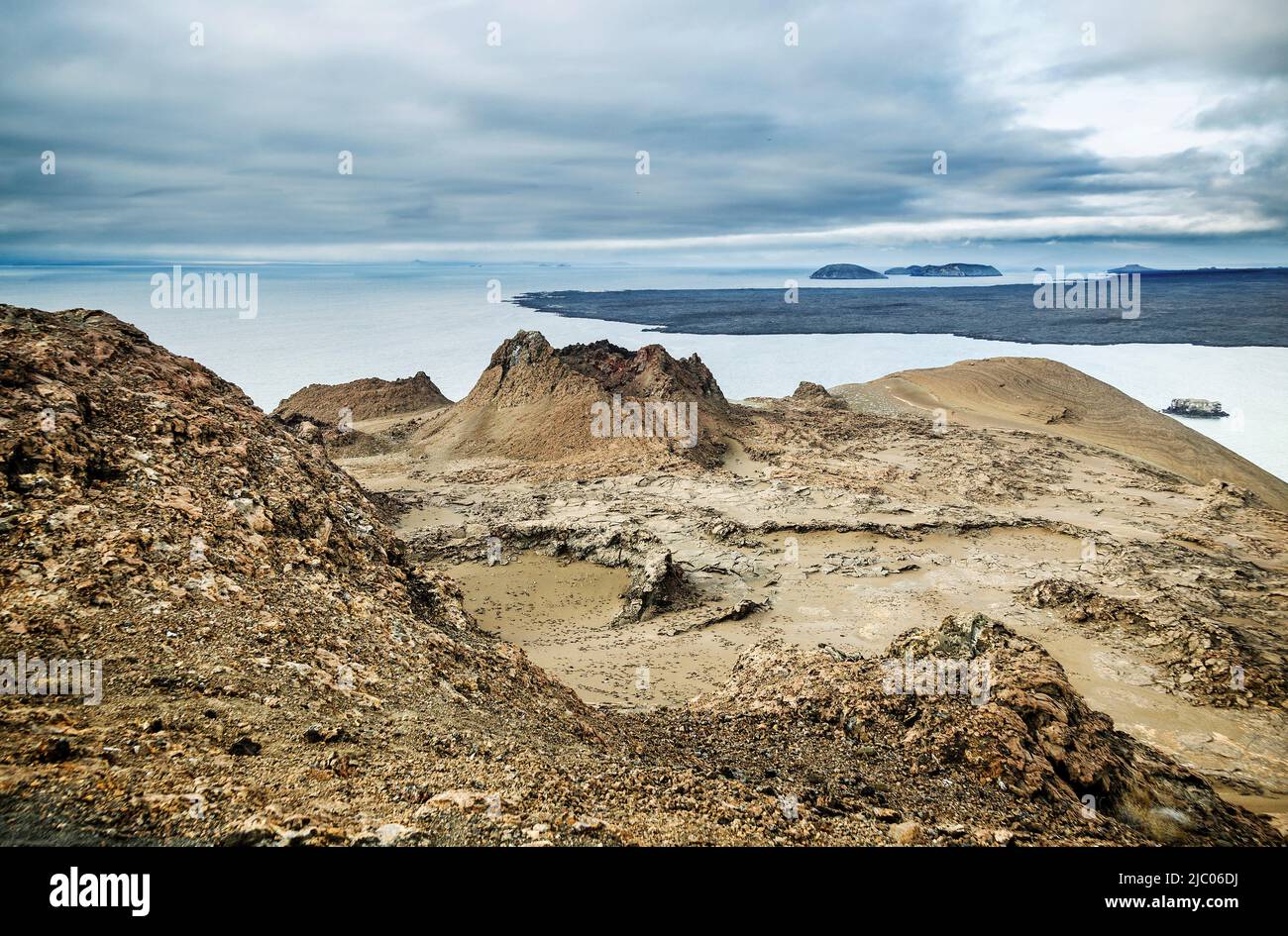 Ecuador, Galapagos Islands, Rocky sand beach along ocean Stock Photo ...