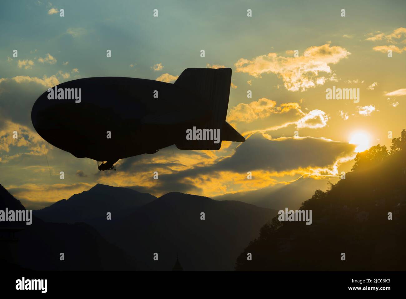 Blimp Flying over the Mountain in Sunset in Locarno, Switzerland Stock ...