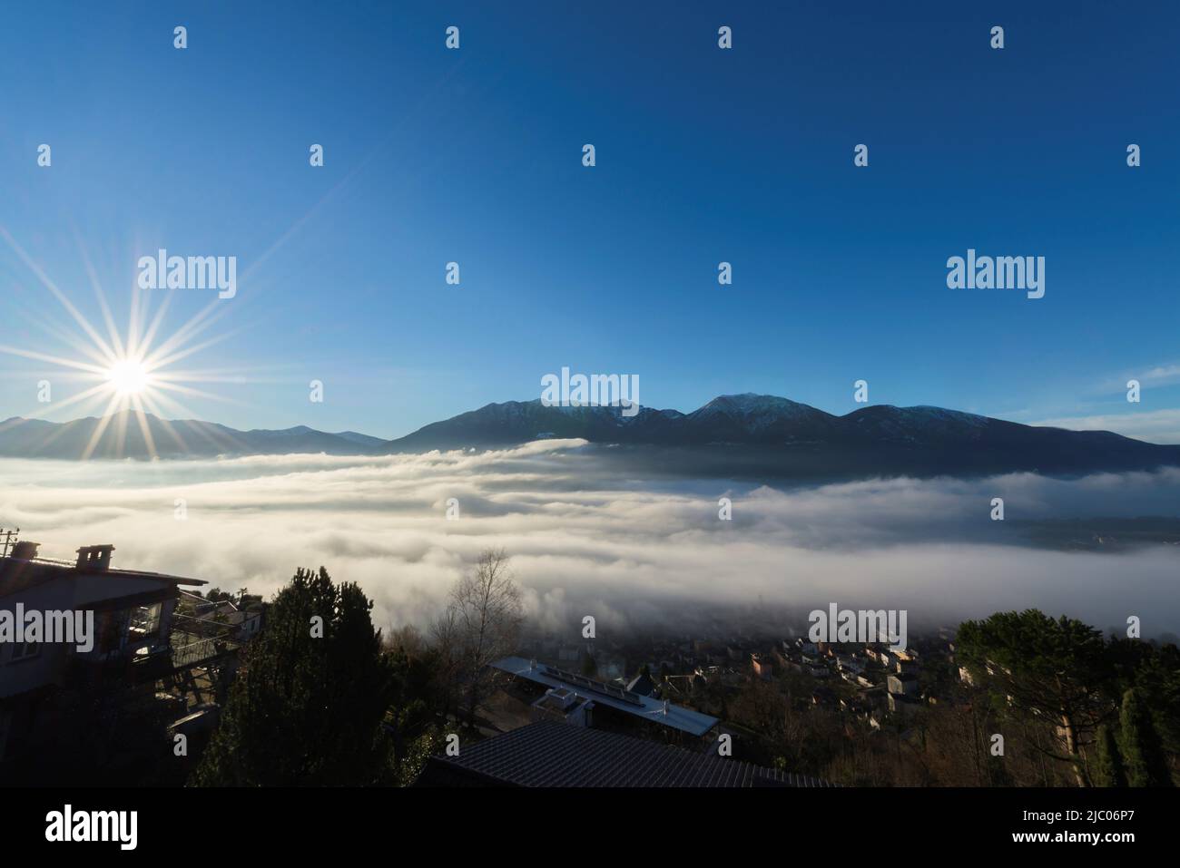 Sunbeam Above Cloudscape and Snow-capped Mountain over an Alpine ...