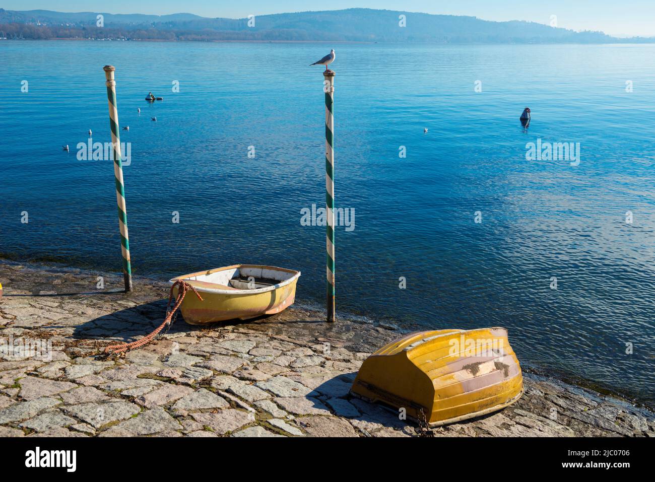 Boat on Waterfront on Alpine Lake Maggiore with Sunlight in Arona ...