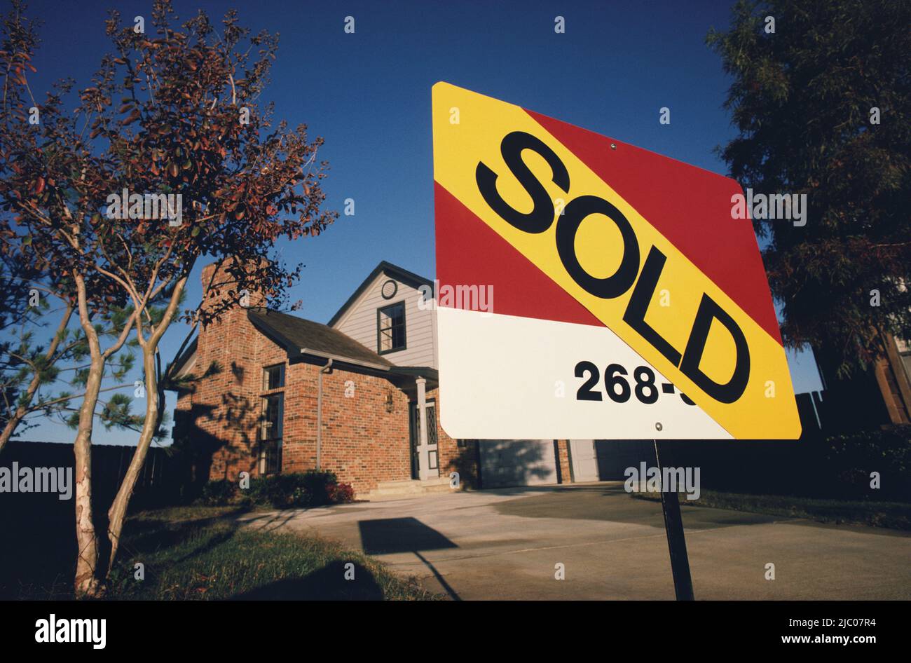 Sold sign in front of a house, Las Colinas, Texas, USA Stock Photo - Alamy