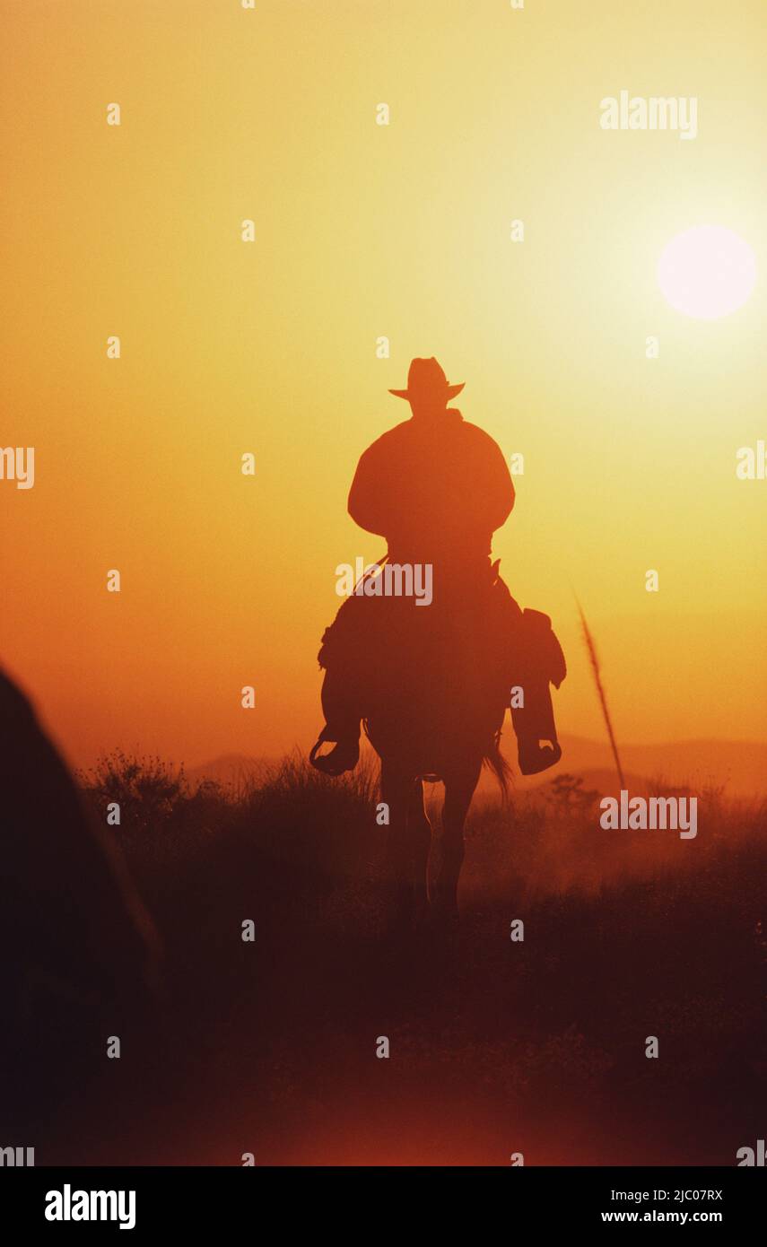 Wild west riding sunset hi-res stock photography and images - Alamy
