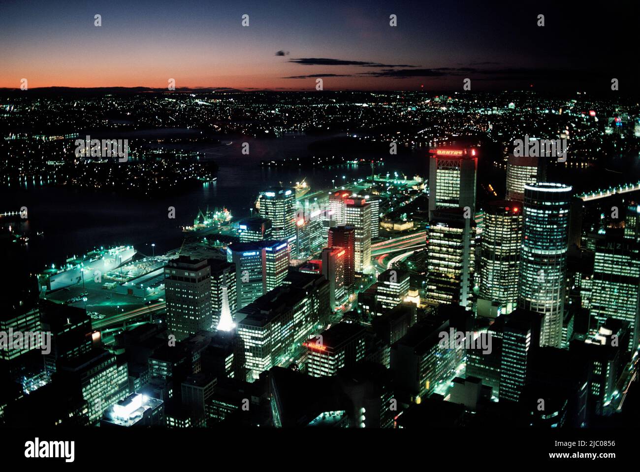Aerial view of a city lit up at night, Sydney, New South Wales ...