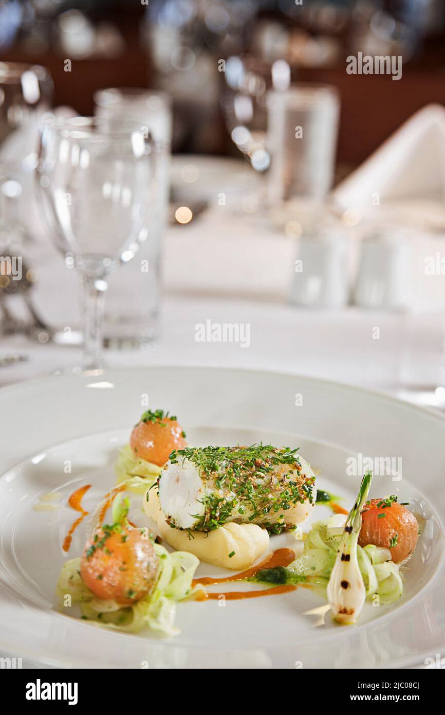 Gourmet fish and vegetables served in a plate Stock Photo - Alamy