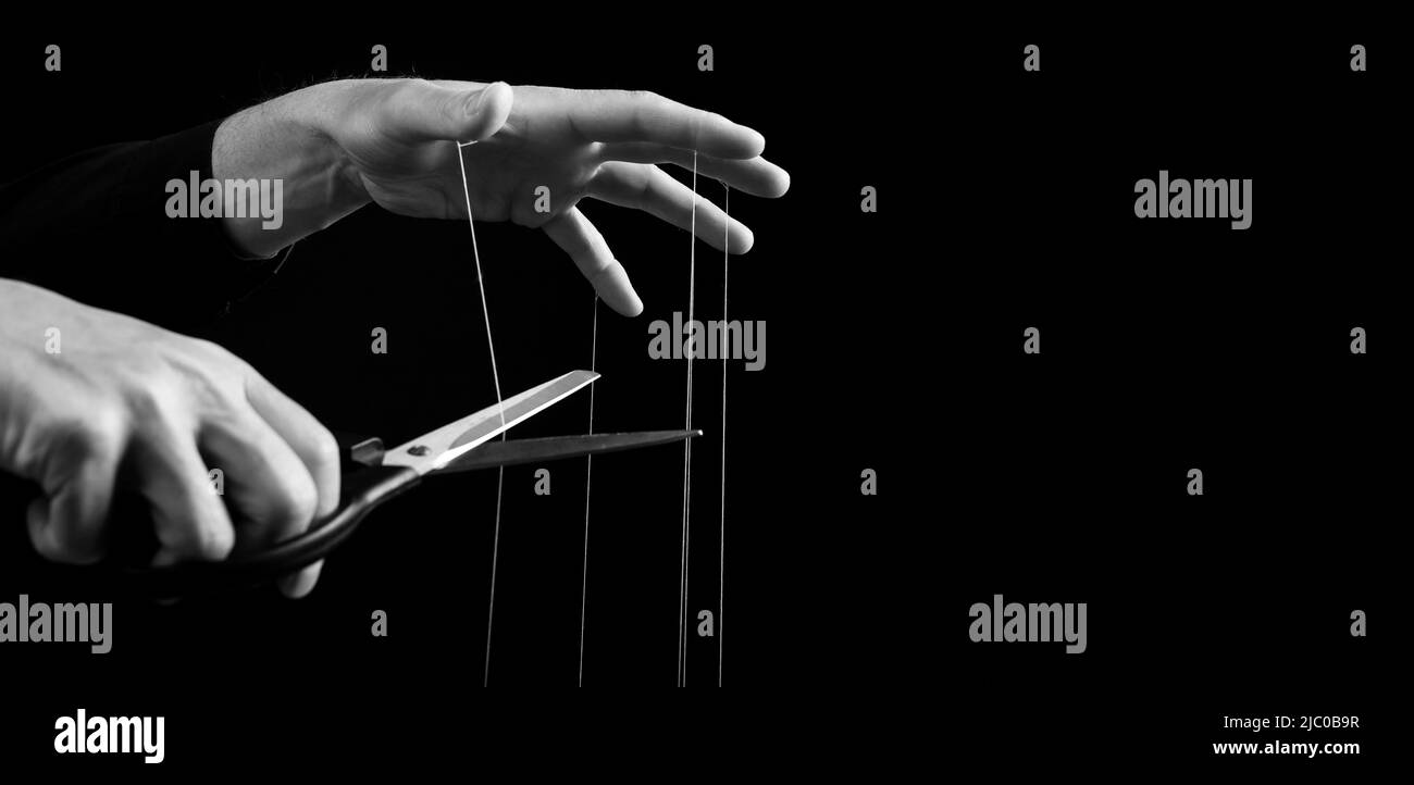 Man hand puppet strings Black and White Stock Photos & Images - Alamy