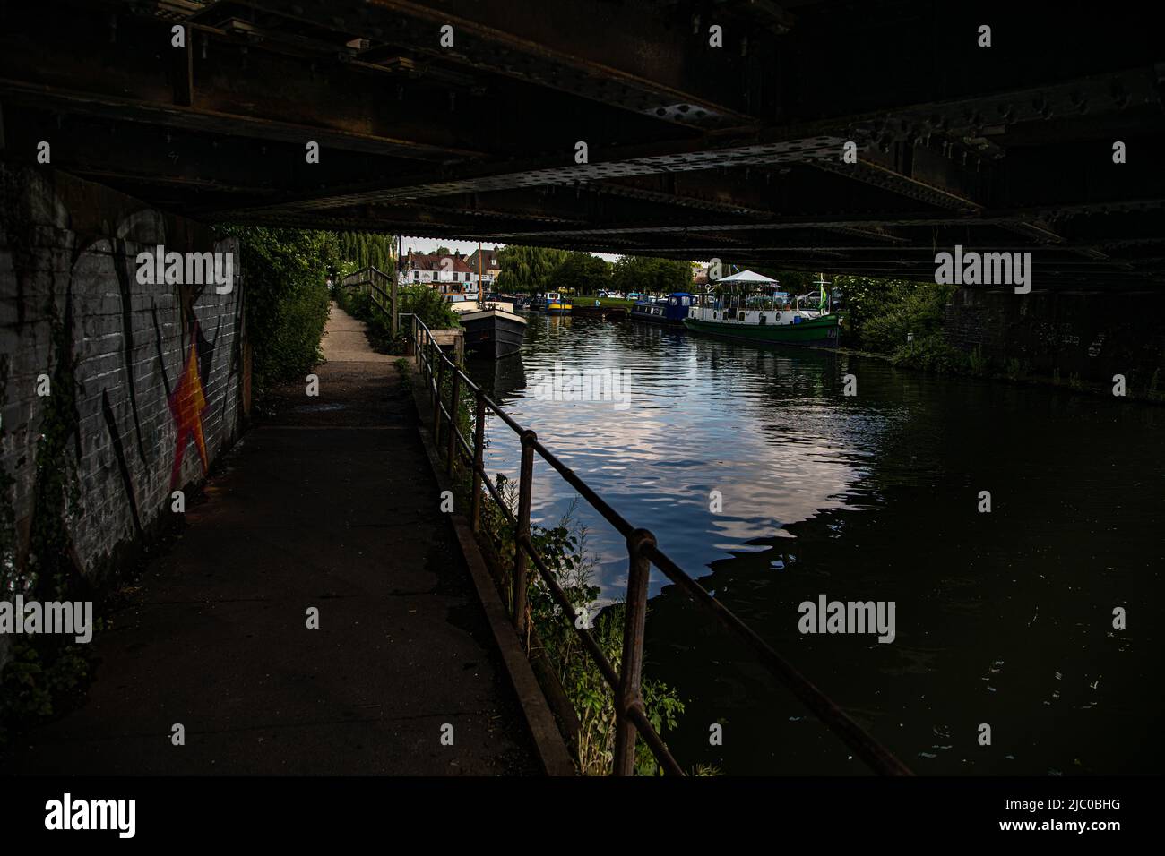 Graffiti under the railway bridge, Riverside, Ely Stock Photo - Alamy