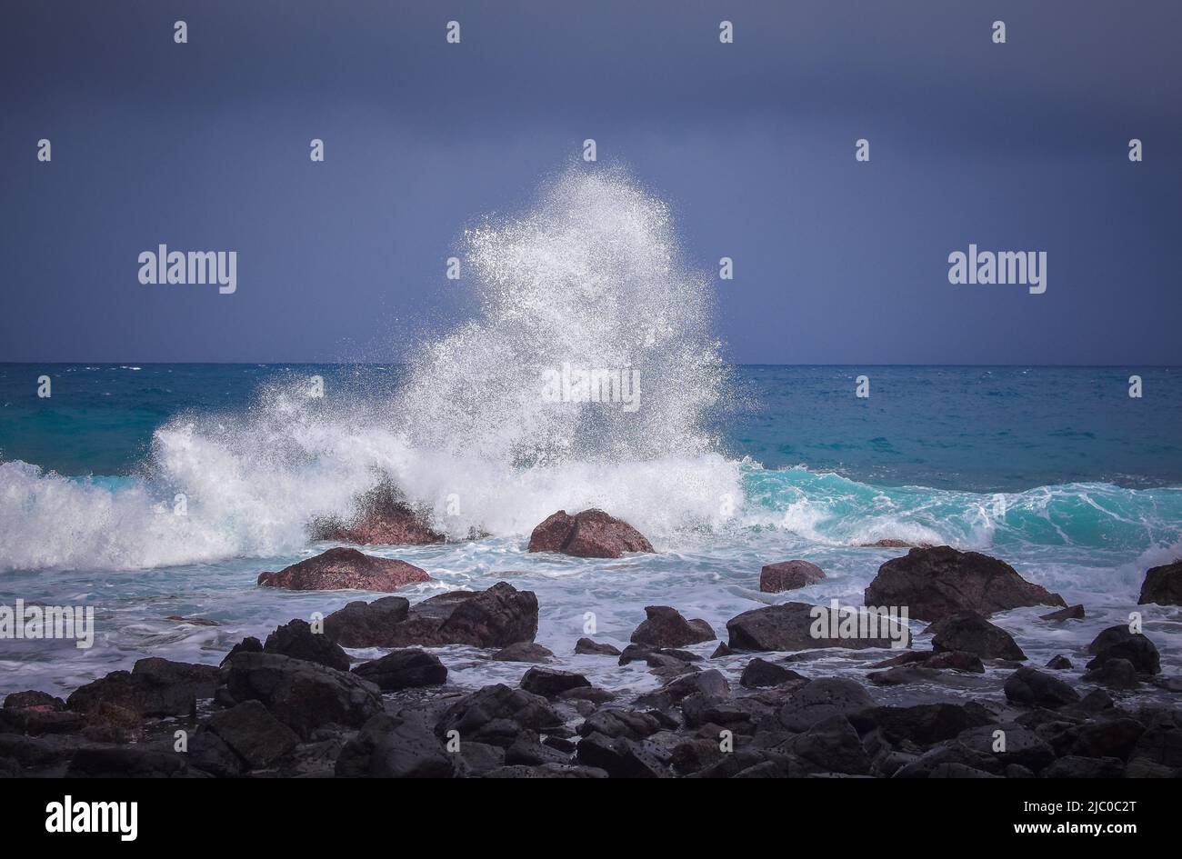 Big wave hit the rock in beach during bad weather Stock Photo - Alamy