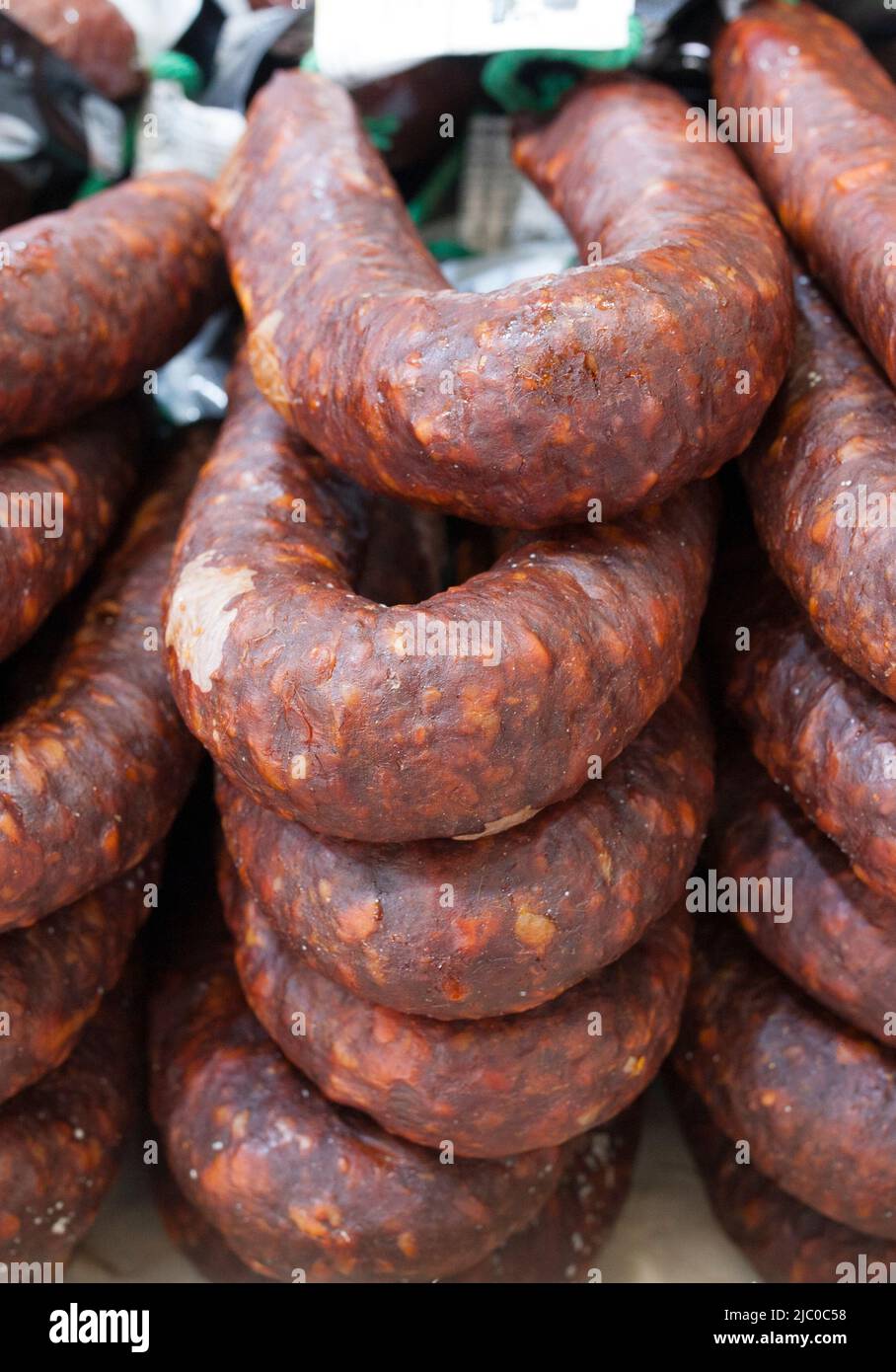 Red iberian chorizo displayed at street market stall. Closeup Stock ...