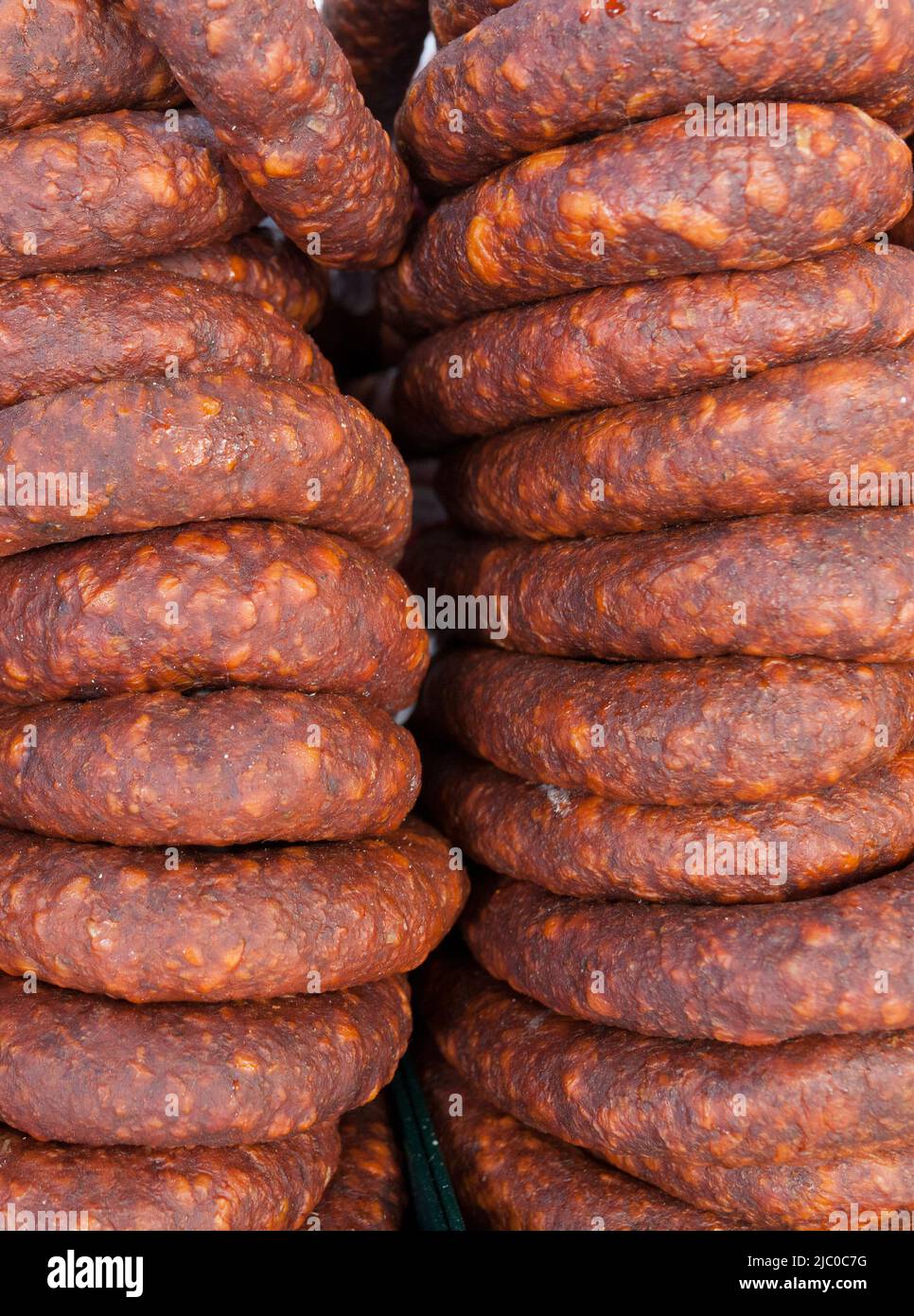 Red iberian chorizo displayed at street market stall. Closeup Stock ...