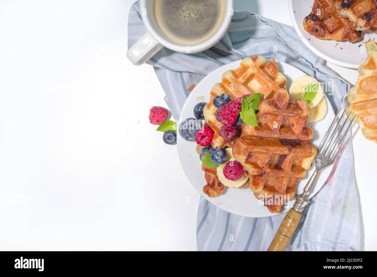 Modern dessert croffle - mixture of croissants and waffles, puff baking ...