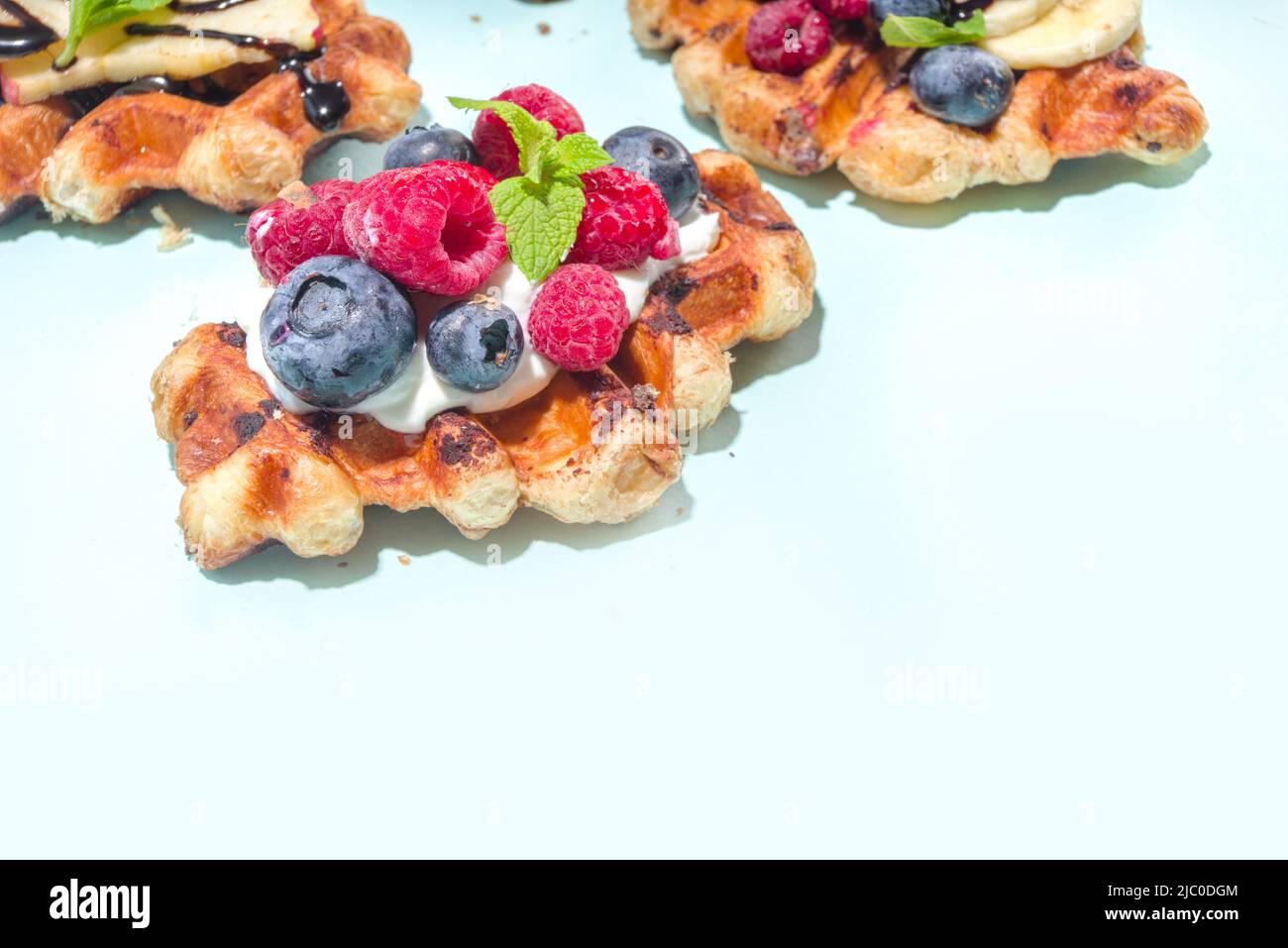 Modern dessert croffle - mixture of croissants and waffles, puff baking ...
