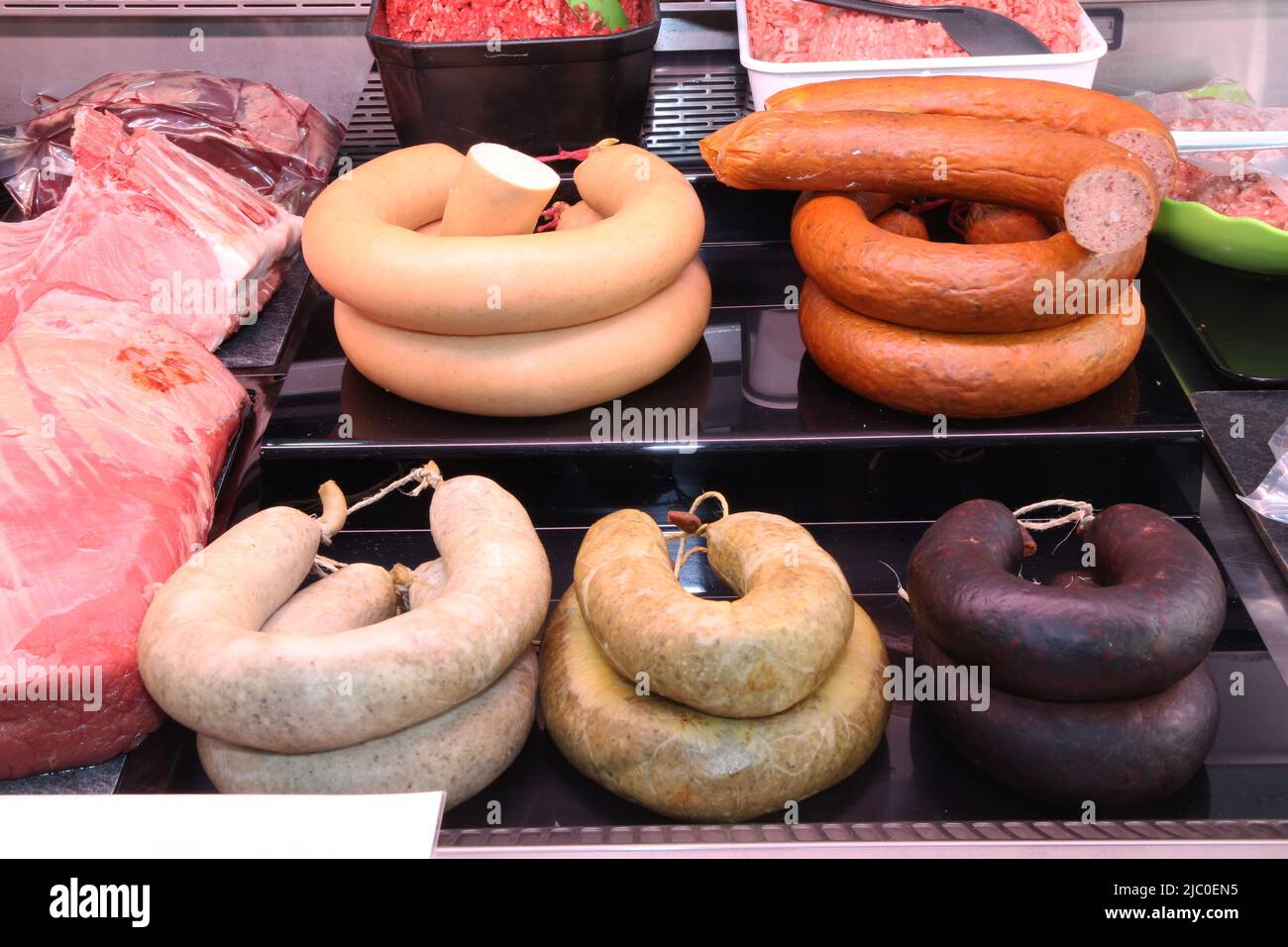Sausage counter in a butcher's shop Stock Photo - Alamy
