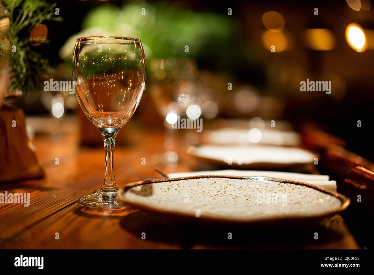 Luxury table settings for fine dining with and glassware, pouring wine ...