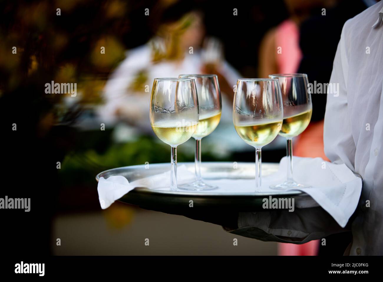 Luxury table settings for fine dining with and glassware, pouring wine ...