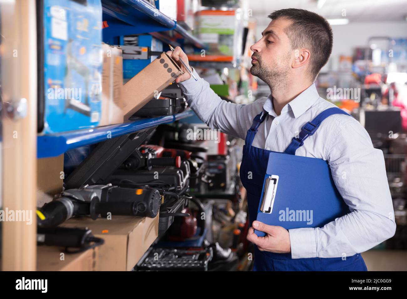 Male supermarket employee making hi-res stock photography and images ...