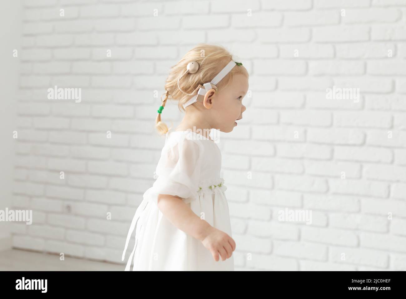 Baby child with hearing aids and cochlear implants and diversity on ...