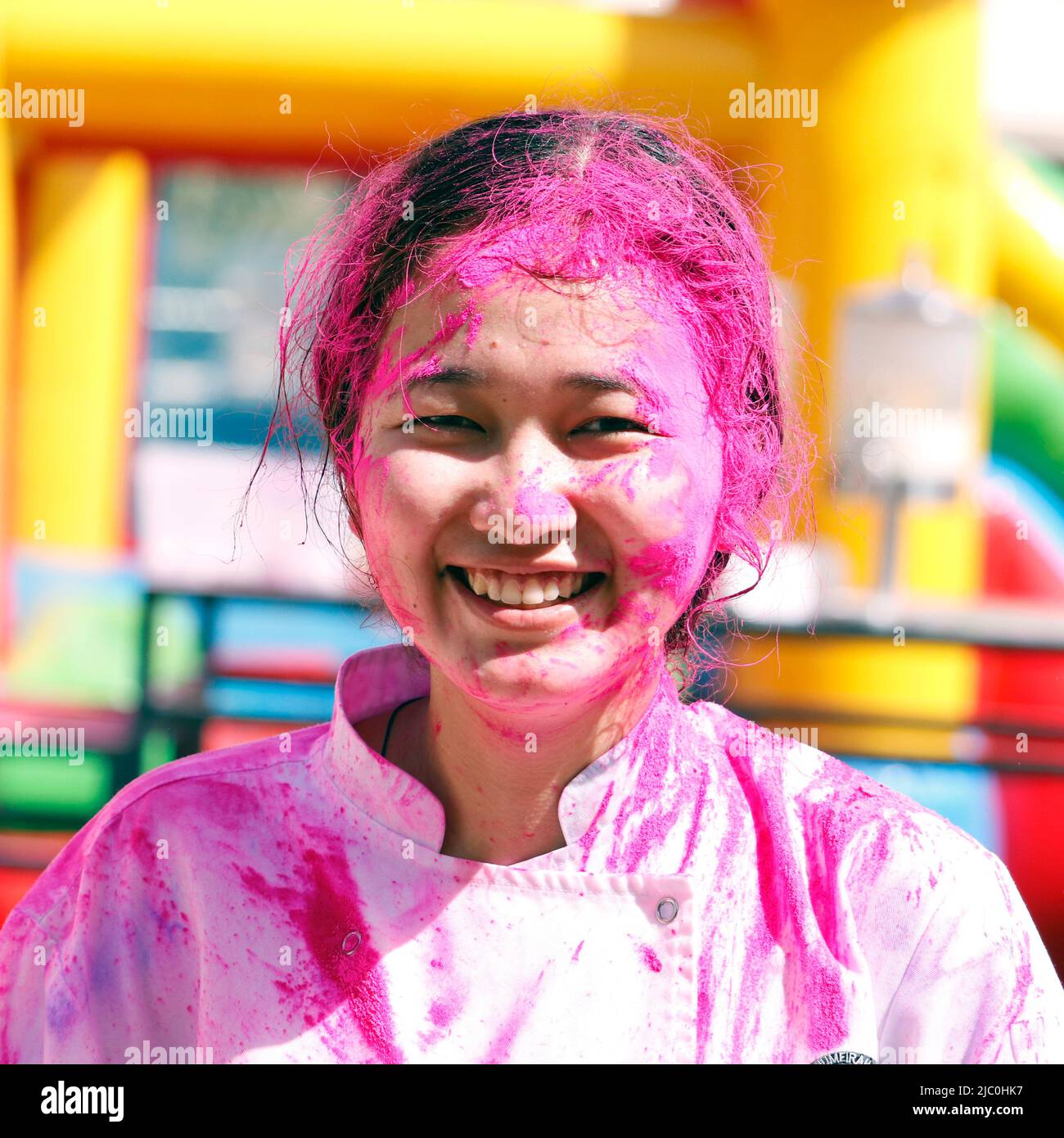 beautiful Indian lady With Colored Face celebrating festival of colors ...