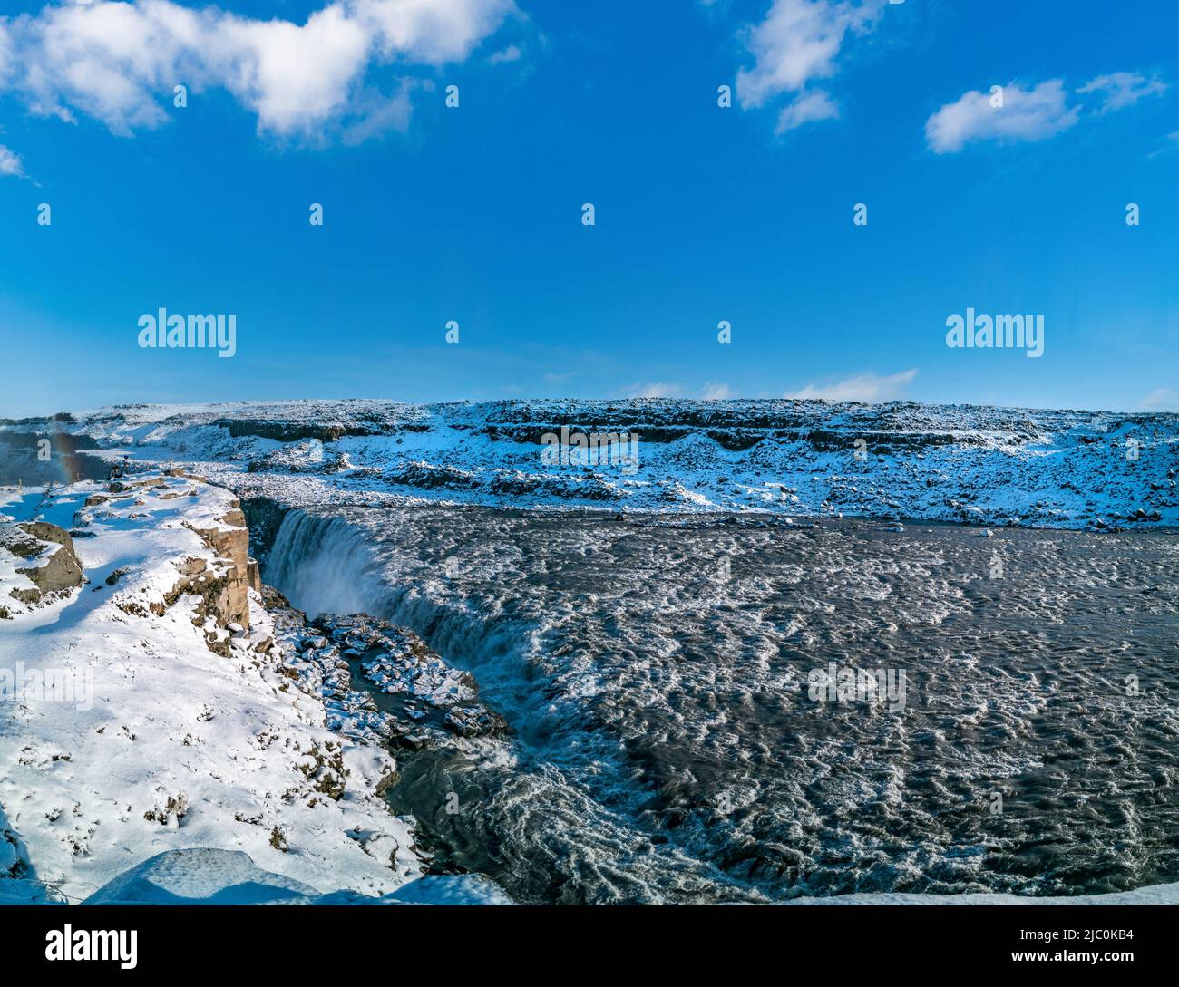 Dettifoss massive waterfall panoramic view and blue sky Stock Photo - Alamy
