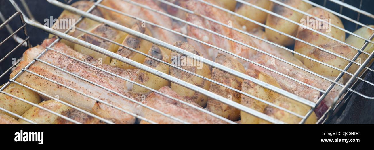 Raw vegetable and slices of meat cooking on grill outdoors Stock Photo ...