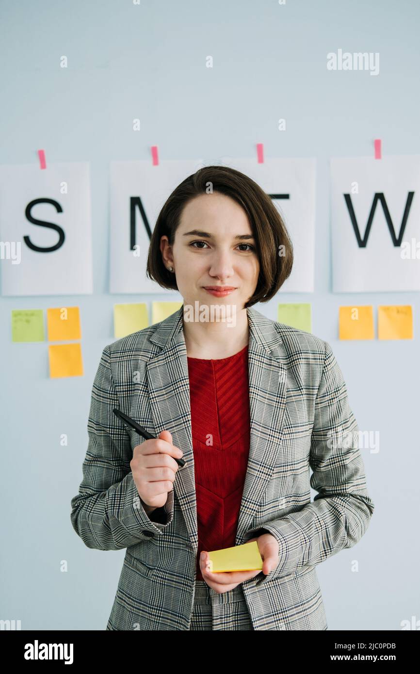 Business planning strategy. Businesswoman, manager standing in office ...