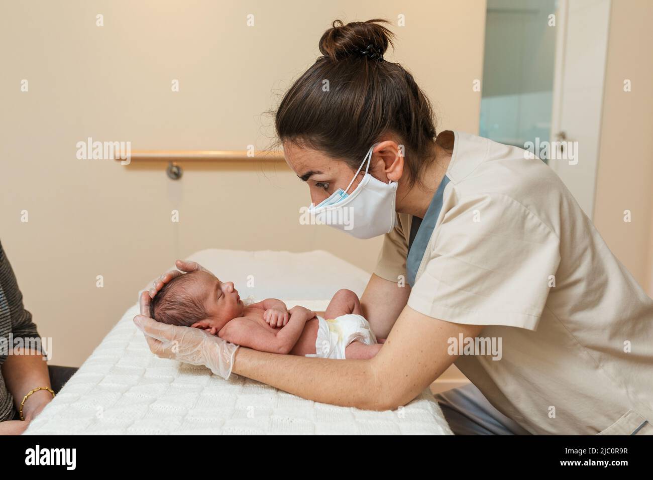 Professional physiotherapist doing parietal work and lambdoid suture in ...