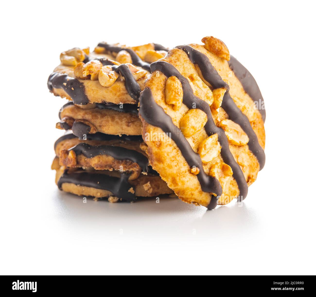 Chip cookies with peanuts and chocolate strips isolated on a white ...