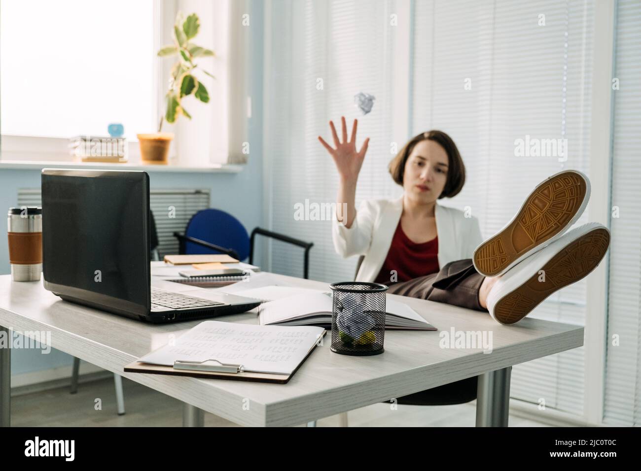 Job burnout, Tired businesswoman throws crumpled papers into bin on ...