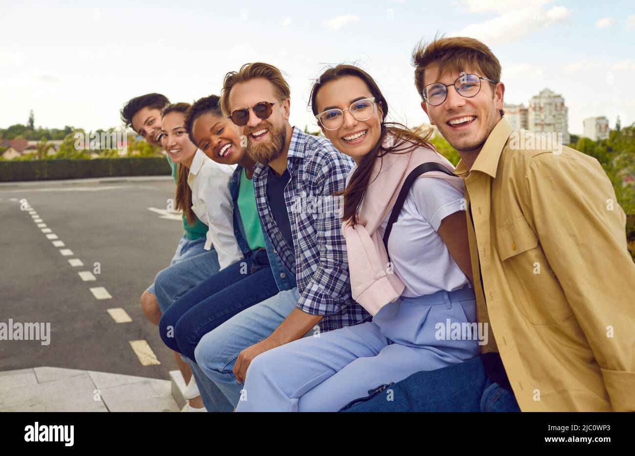 Group portrait of cheerful young multiethnic friends having fun in the ...