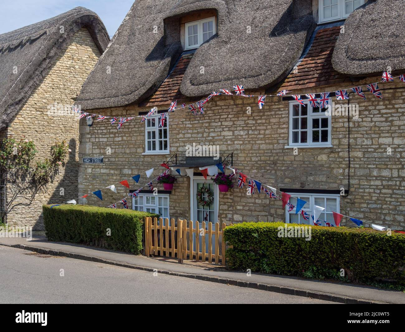 Stone built traditional thatched cottage in the village of Stoke ...