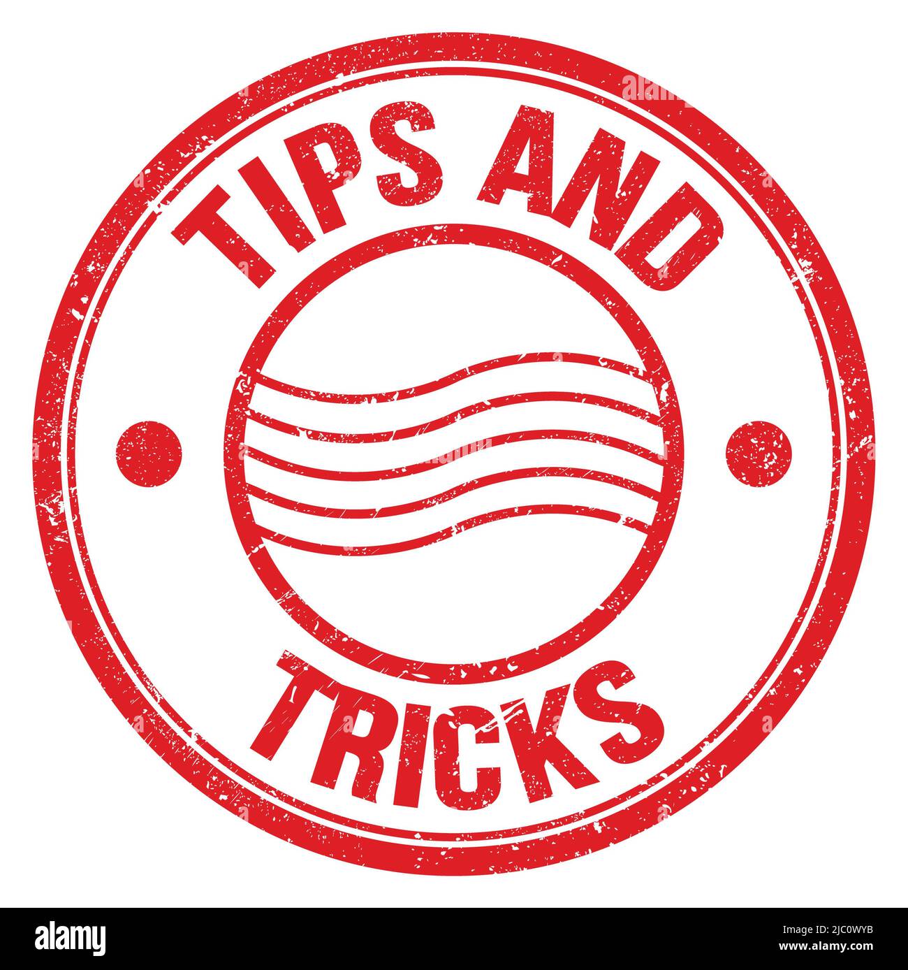 TIPS AND TRICKS text written on red round postal stamp sign Stock Photo ...