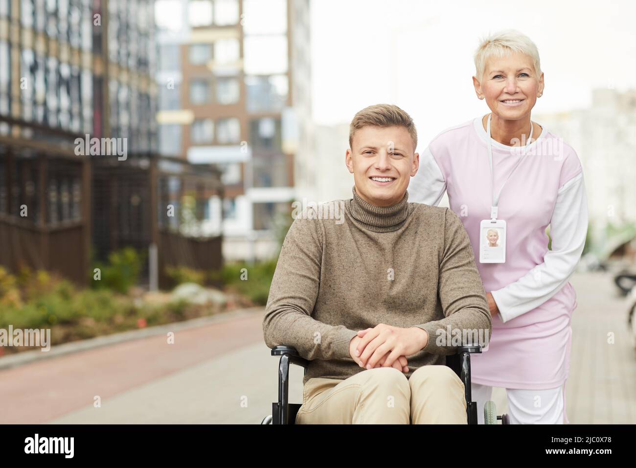 Portrait of smiling careful mature female recovery specialist with ...