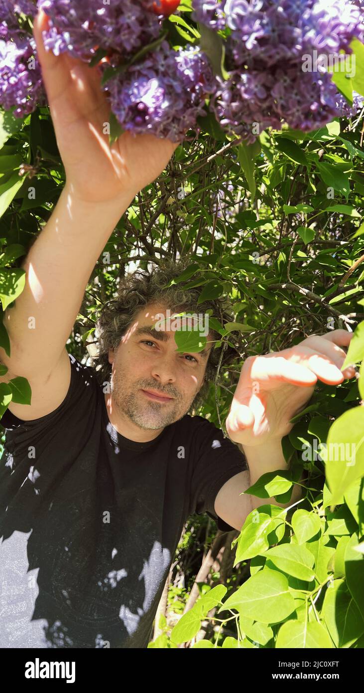 Guy Peeking Over Bushes