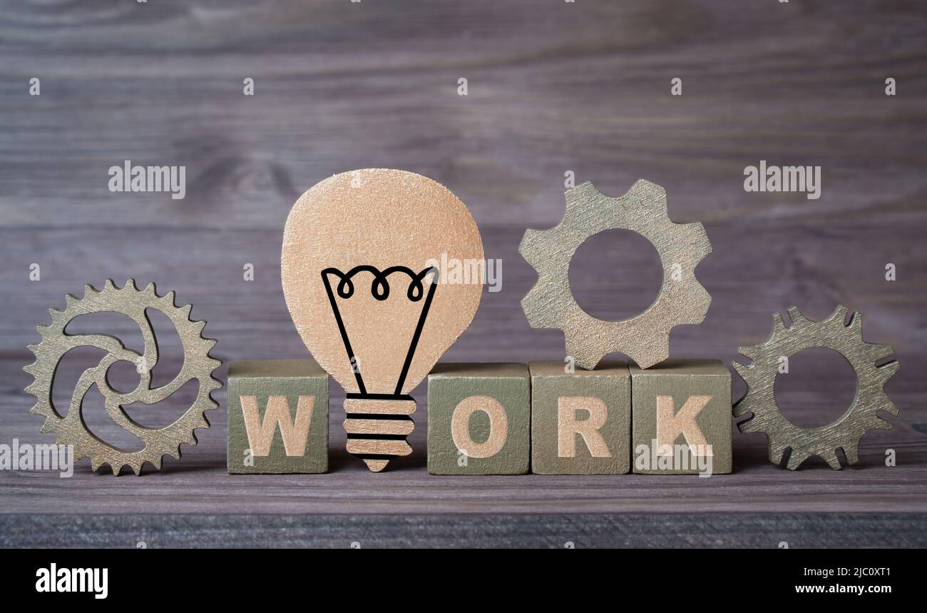 Word WORK made from letter blocks with cogwheels and a lightbulb symbol ...