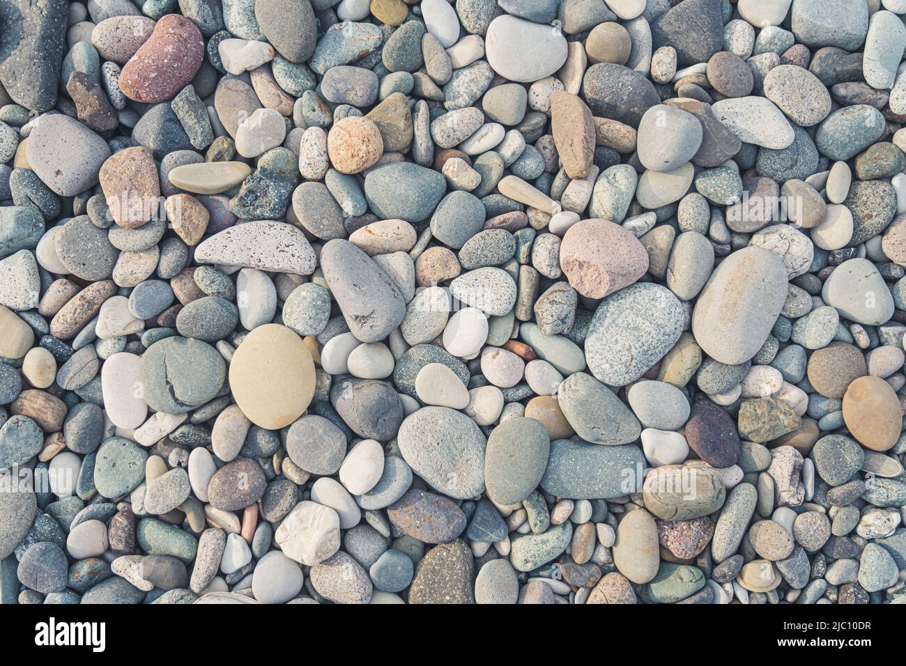 Dry sea pebbles background. Unconventional summer holidays souvenir ...