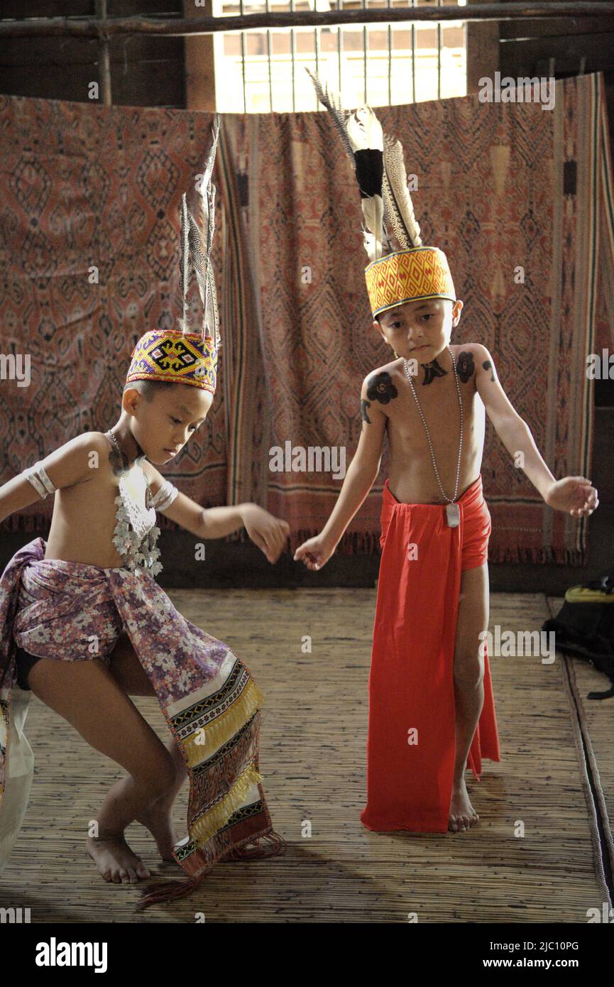 Children in traditional attires performing a traditional dance during ...