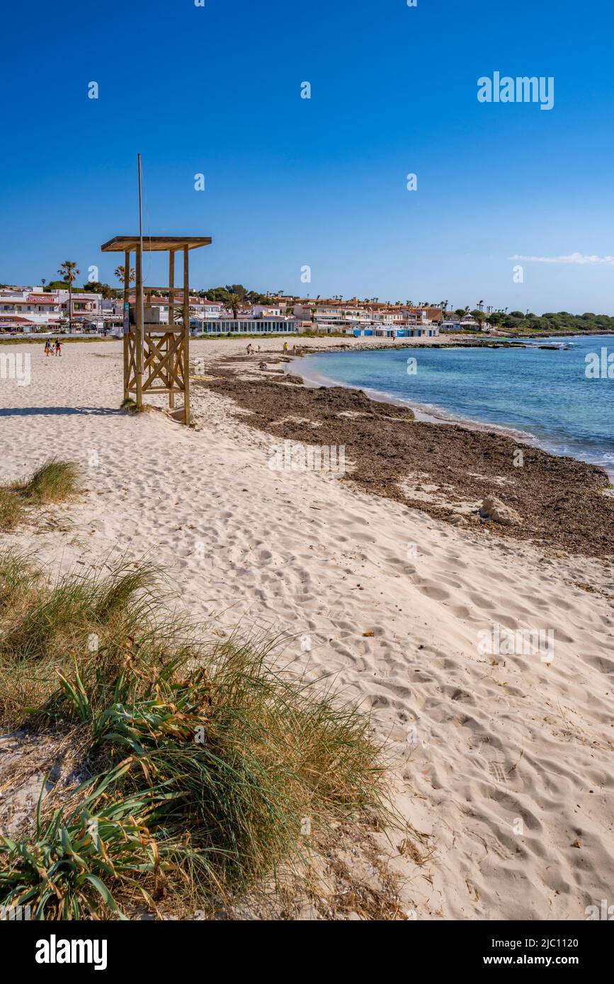 View of sea front and lifeguard tower at Playa Punta Prima, Punta Prima ...