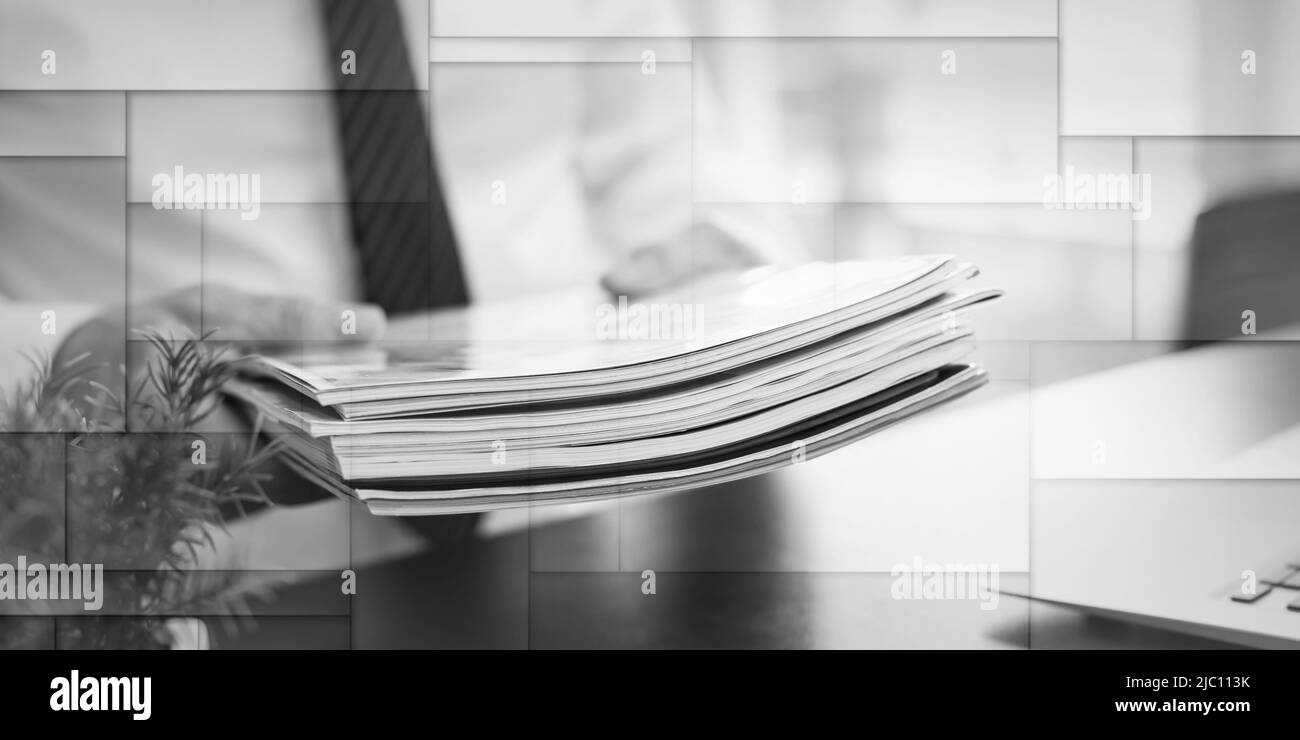 Holding magazines stack Black and White Stock Photos & Images - Alamy