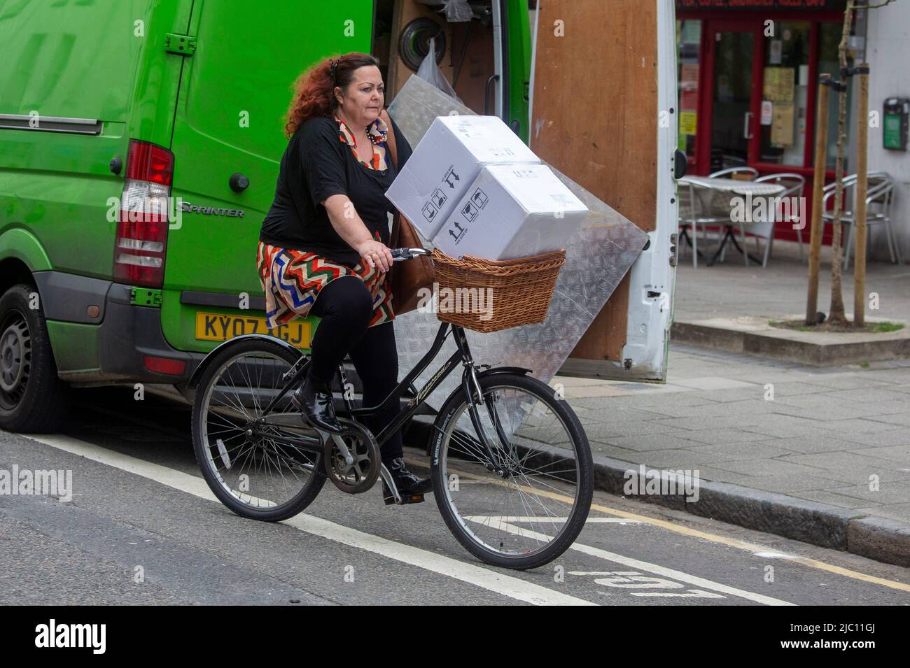 bike woman with boxes Stock Photo - Alamy