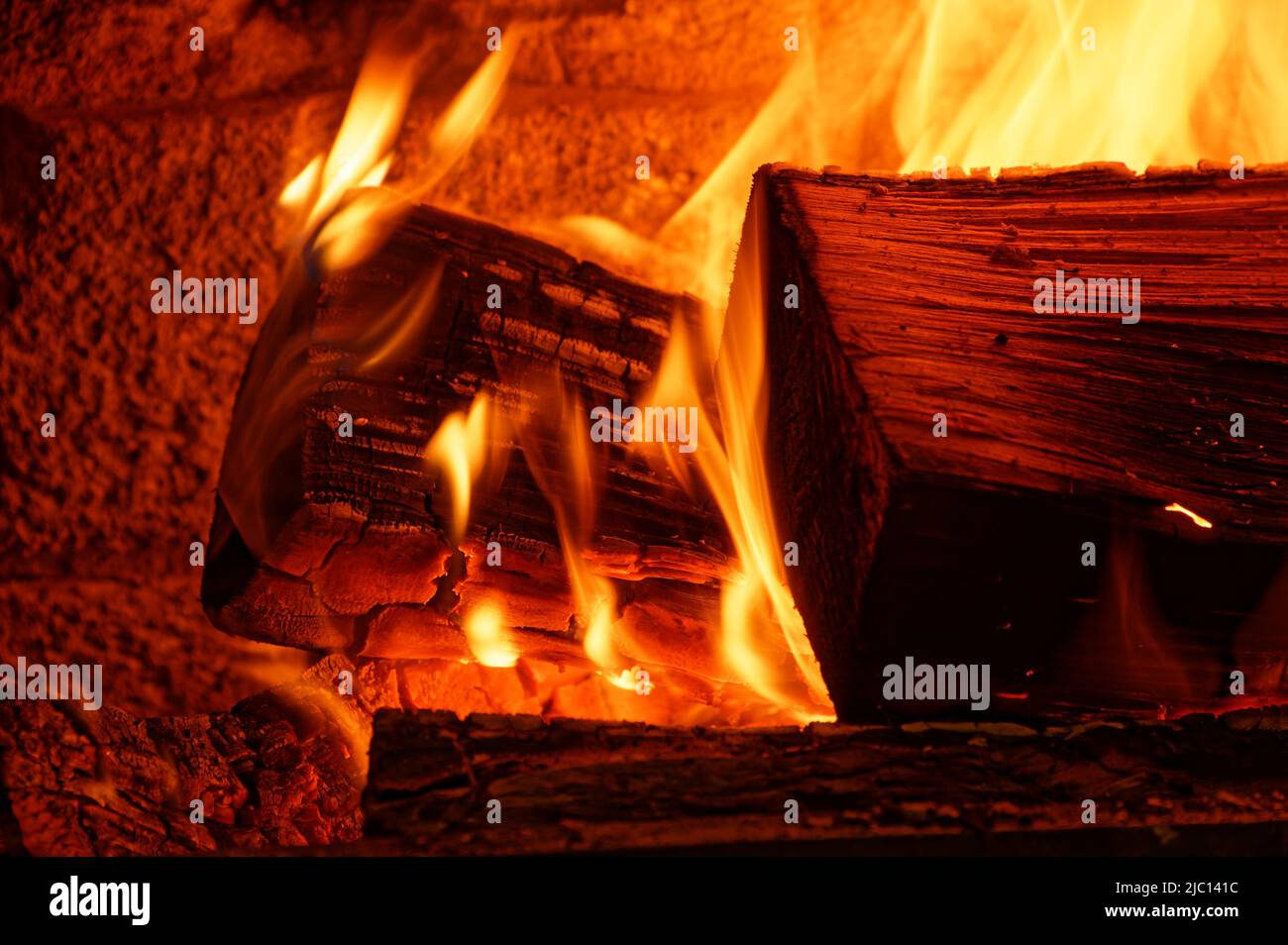 An open fire provides winter warmth, the orange flames are dancing ...