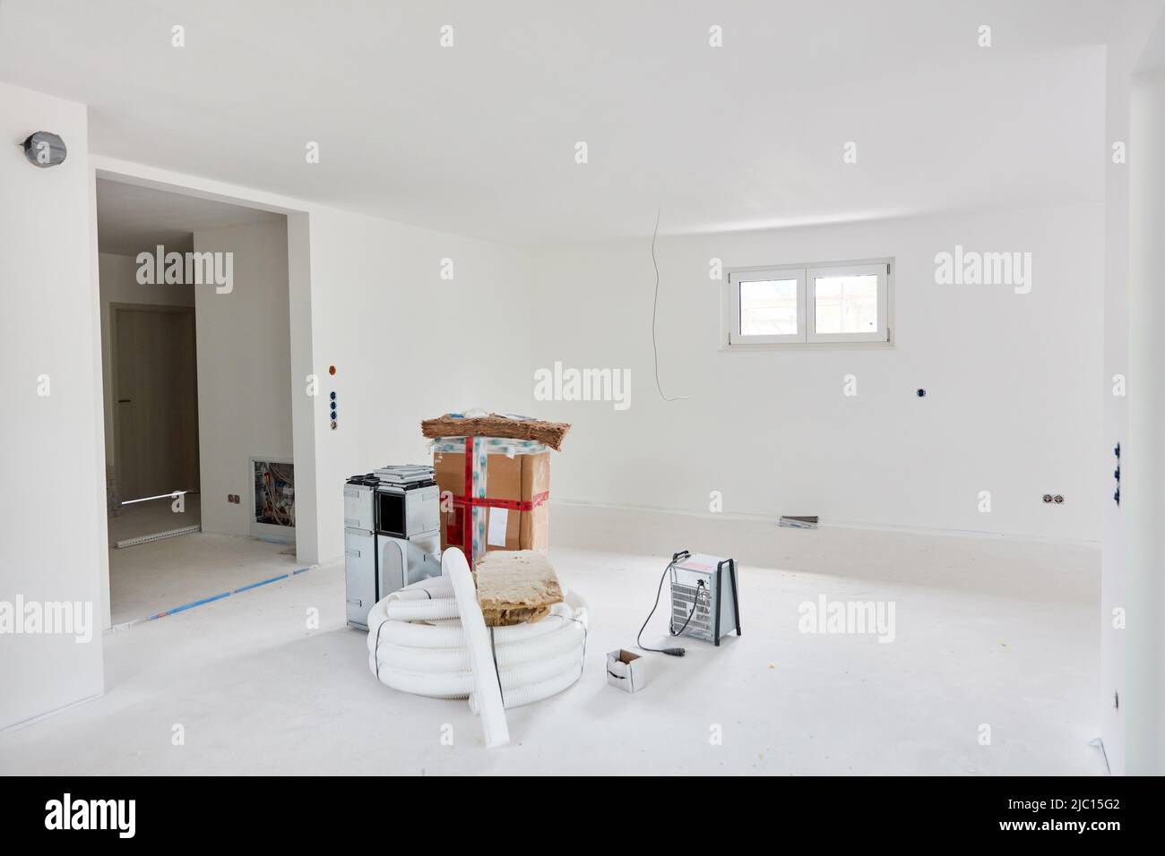 Interior finishing of a house after painting in the large white room ...