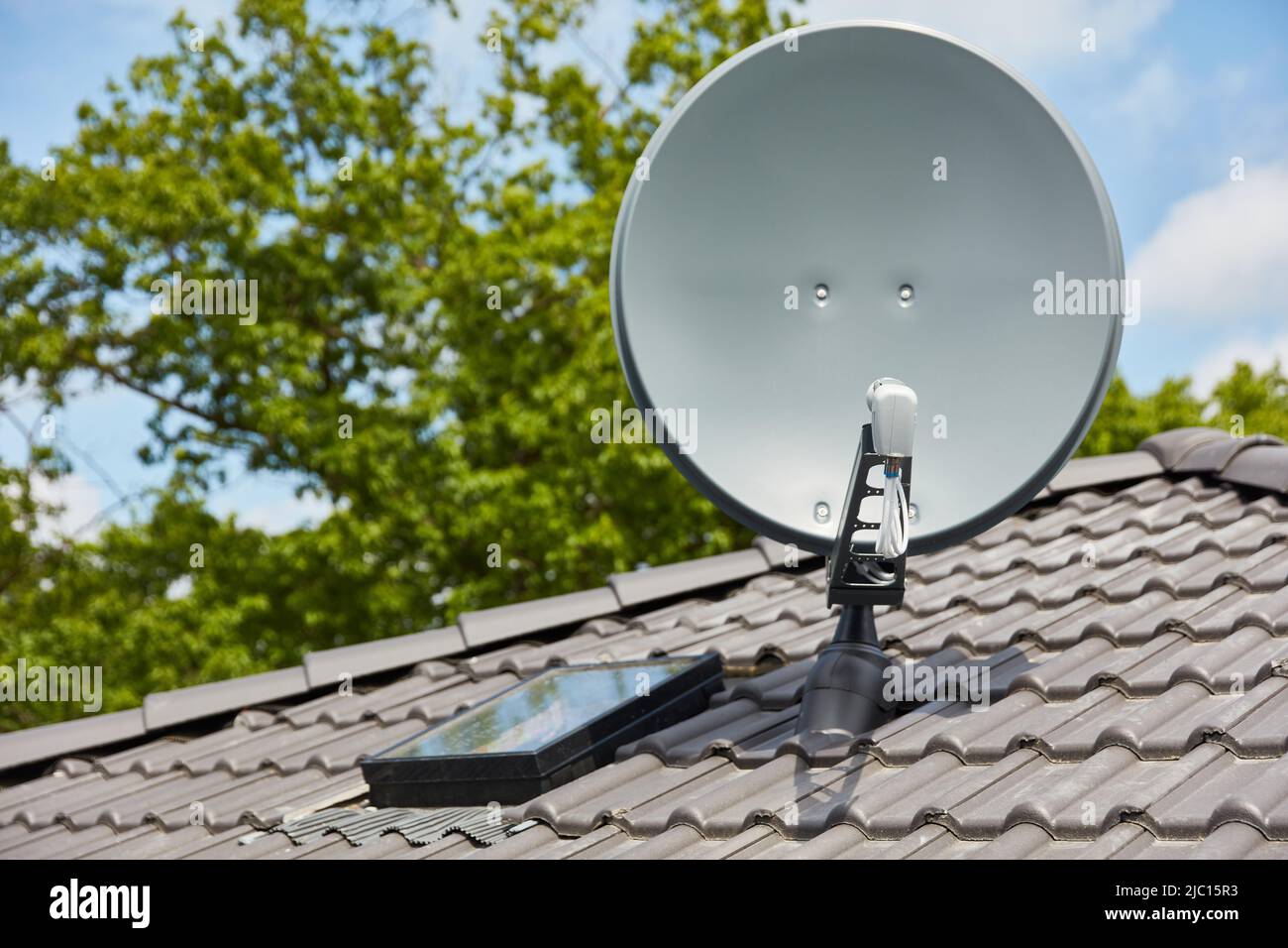 Modern satellite dish on the roof for satellite TV reception Stock ...