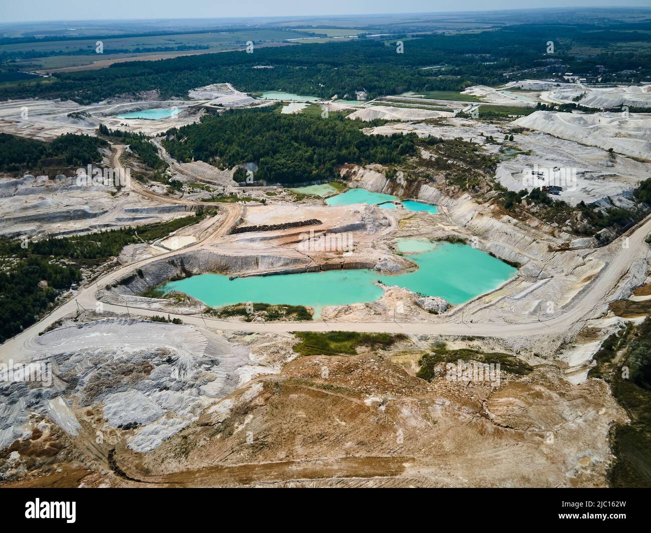Aerial view quarry extraction porcelain clay, kaolin, with turquoise ...