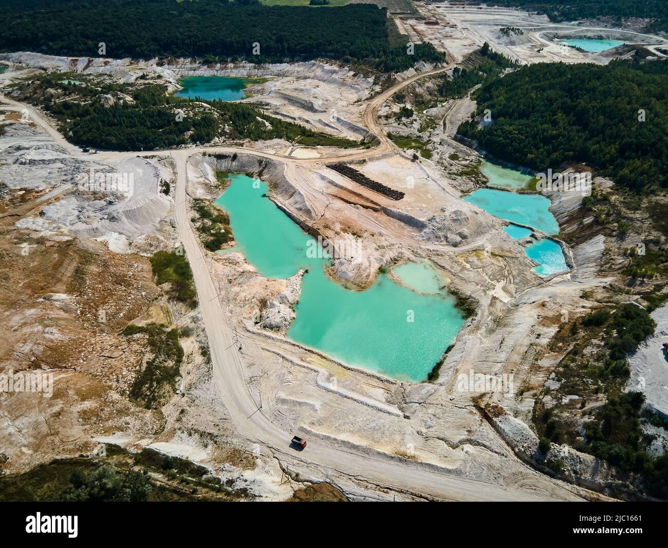 Aerial view quarry extraction porcelain clay, kaolin, with turquoise ...