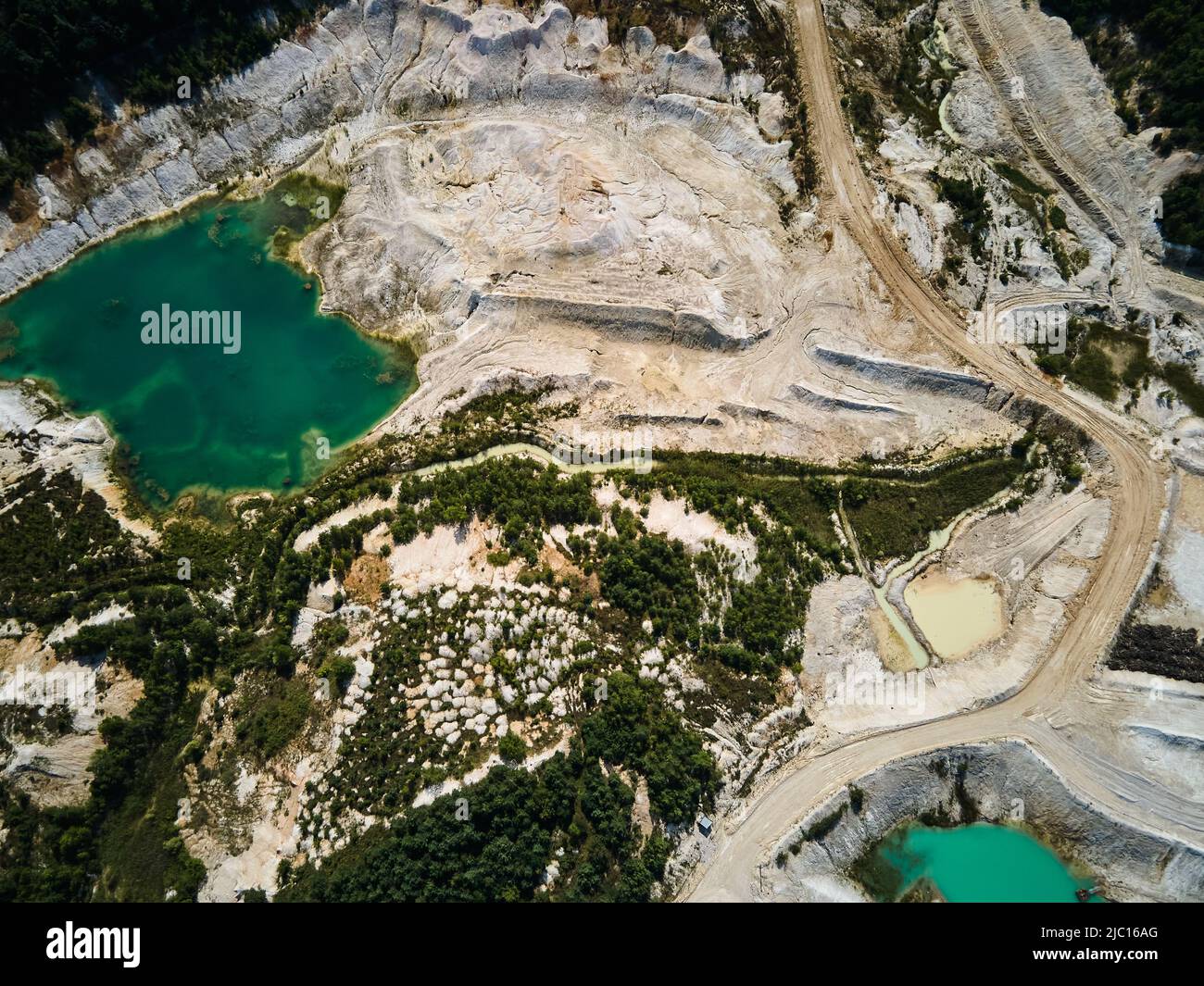Aerial view quarry extraction porcelain clay, kaolin, with turquoise ...