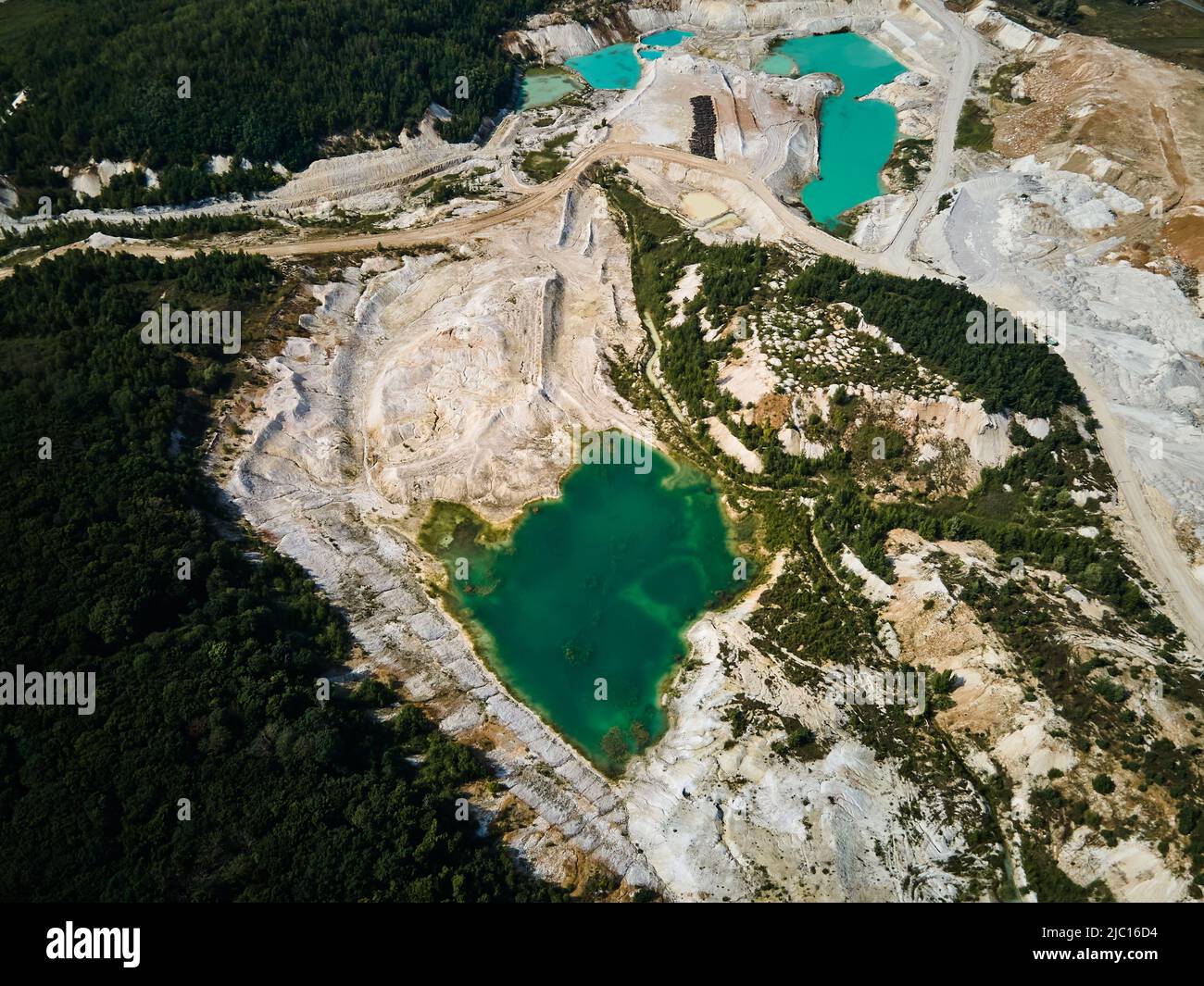 Aerial view quarry extraction porcelain clay, kaolin, with turquoise ...