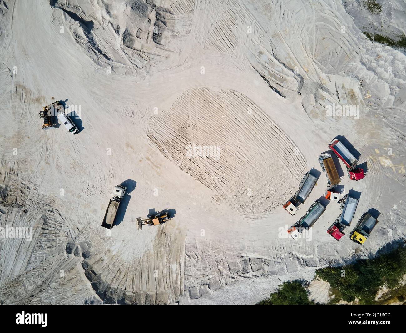 Aerial view trucks near quarry extraction porcelain clay, kaolin, with ...