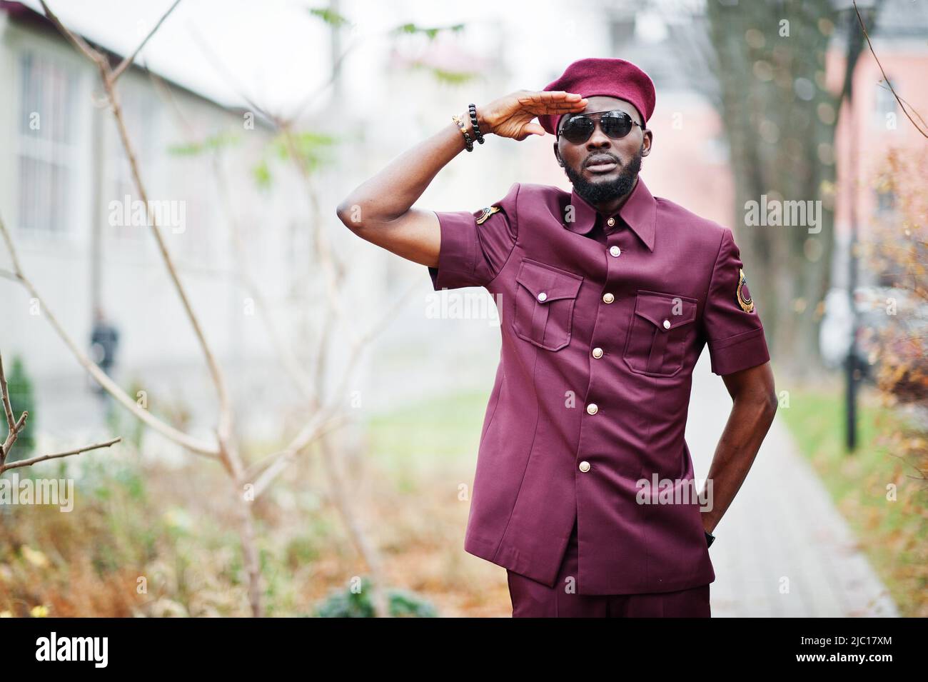 Portrait of African American military man in red uniform and beret ...