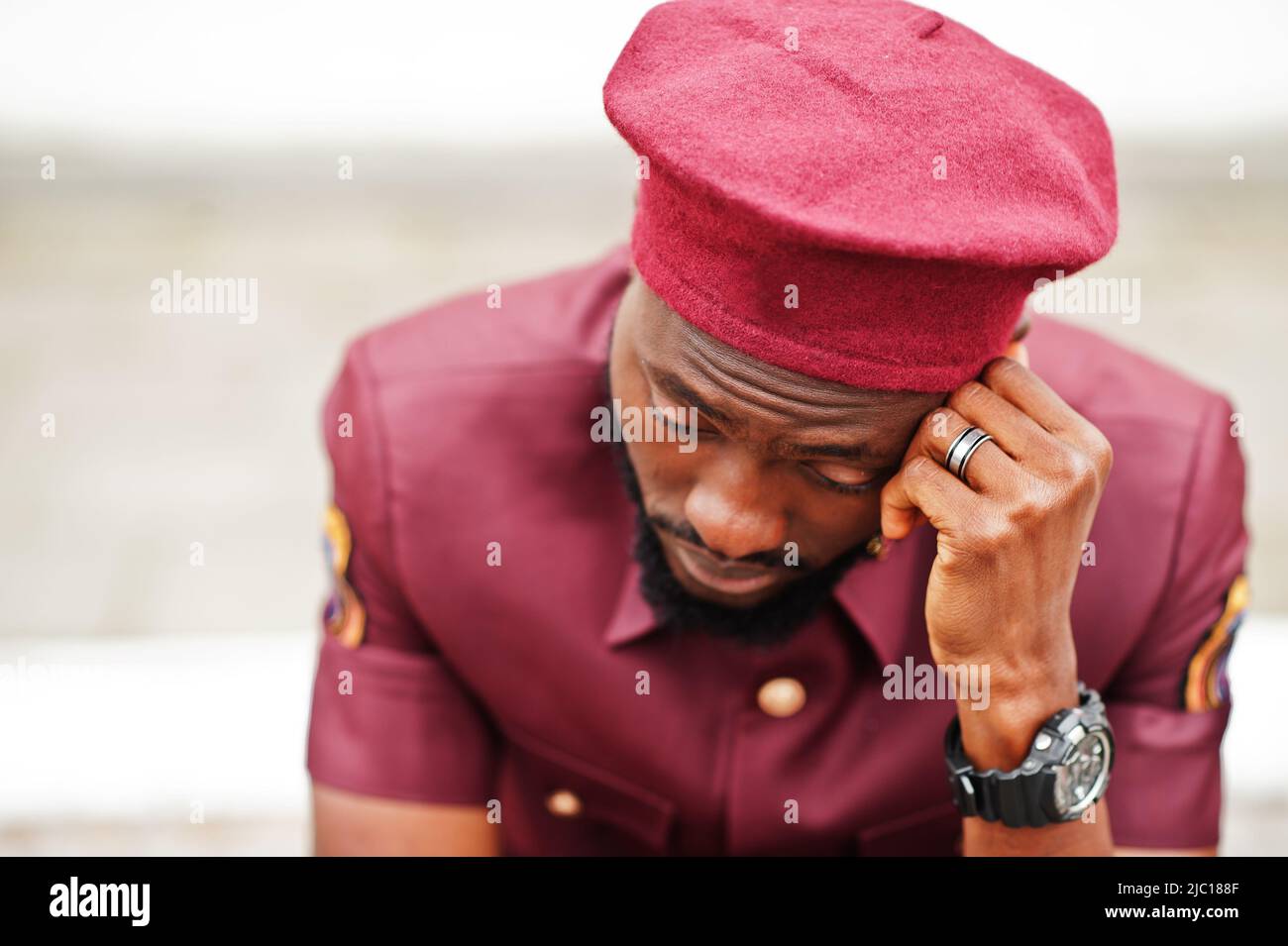 Portrait of African American military man in red uniform and beret ...