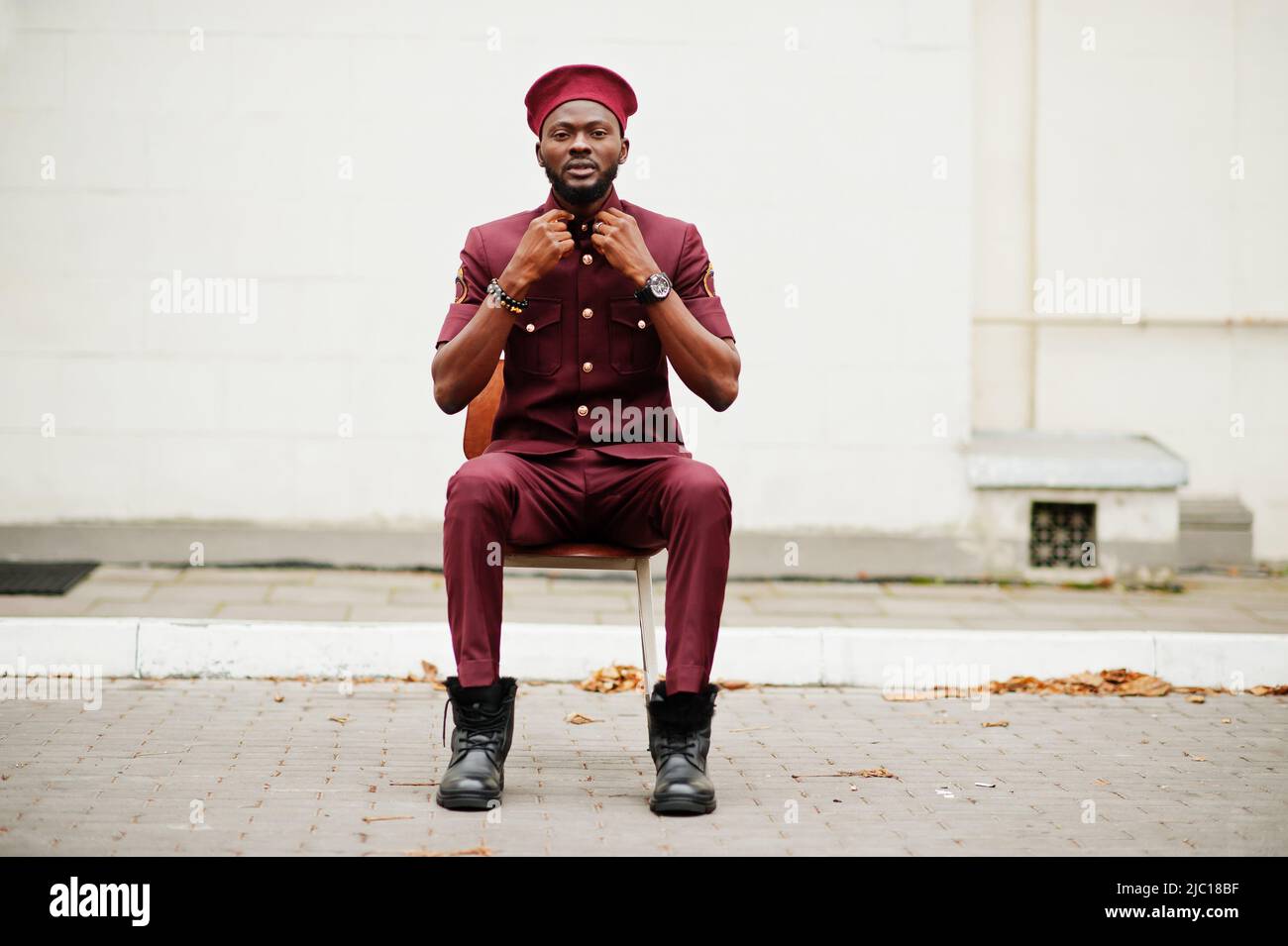 Portrait of African American military man in red uniform and beret ...